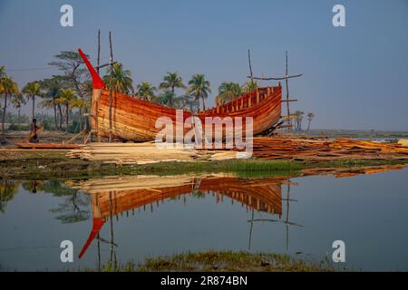 Fishing boats making at Char Fasson in Bhola. Bangladesh Stock Photo ...