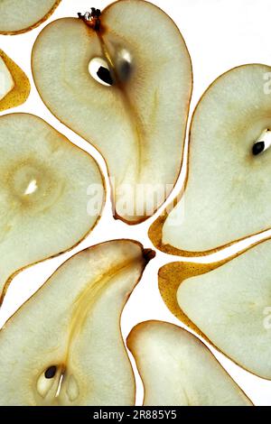 Sliced pear against white background Studio shot Stock Photo - Alamy