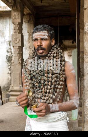 Hindu ascetic ("sadhu") standing in front of a cave ( Khandagiri, India ...