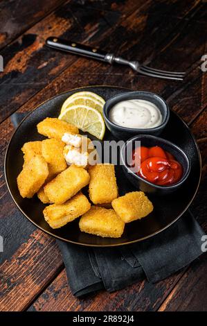 Breaded gold Fish sticks in pan. grey background. top view Stock Photo ...