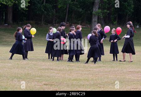 Orthodox Jewish girls celebrate the end of an academic year with a ...