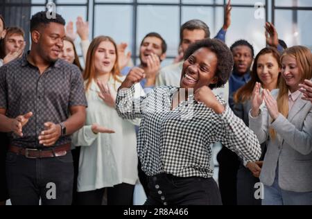 Business team celebrating a triumph with arms up Stock Photo - Alamy