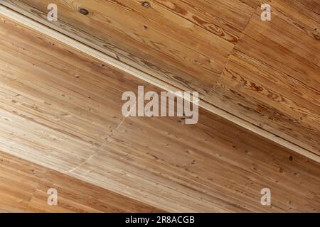 Bent ceiling structure made of wooden planks, architecture background ...