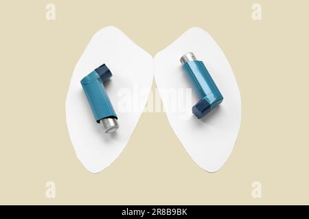 Paper lungs and asthma inhalers on blue background Stock Photo - Alamy