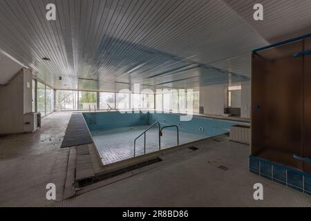Old swimming pool or indoor pool without water which is no longer used ...
