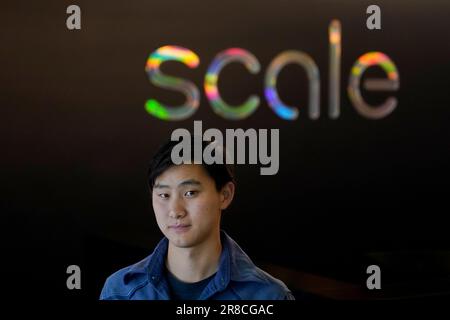 Scale AI founder and CEO Alexandr Wang poses for photos at the company ...