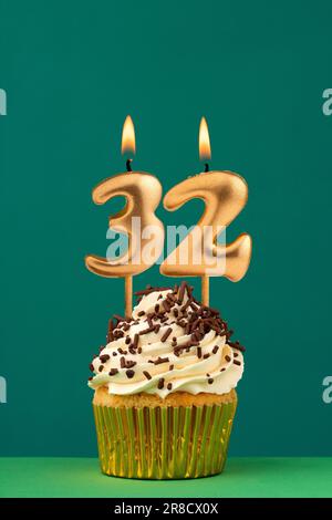 Birthday number 32 - Green birthday candle on white background Stock ...