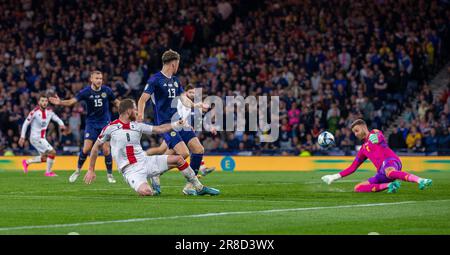 Scotland goalkeeper Angus Gunn saves from Morocco's Achraf Hakimi ...