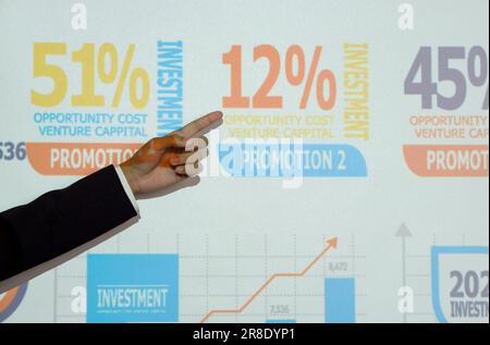 Closeup businessman's hand pointing at venture capital chart on ...
