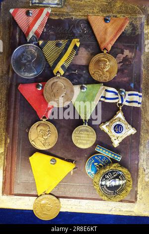 This badge from the former Soviet Union shows Lenin, his hand raised in ...