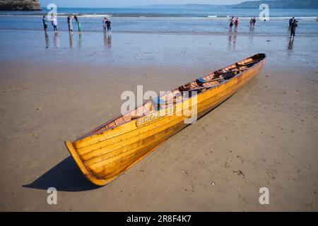 A traditional wooden sea going rowing boat on the beach at Whitby ...