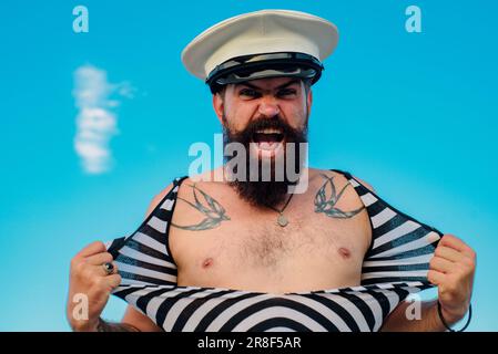 Funny excited captain. Expression face or sailor on sky background ...