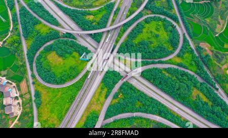 CHONGQING, CHINA - JUNE 20, 2023 - An aerial view of an overpass at a ...