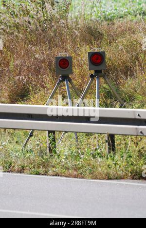 Radar trap hidden behind a safety fence Stock Photo - Alamy
