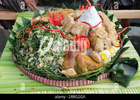 Nasi tumpeng (cone rice) served with urap-urap (Indonesian salad ...