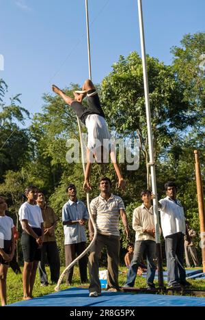 A girl performing Indian Pole Gymnastics, Mallakhamba mallakhamb is an ...