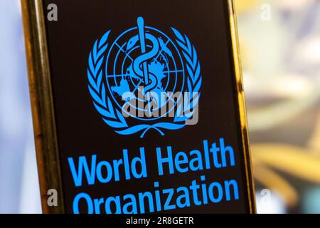 Symbol image: Smartphone with WHO (World Health Organisation) logo ...