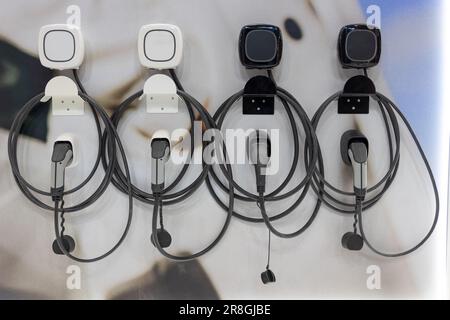 Charging cables at the EV charging station. Mid shot Stock Photo - Alamy
