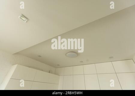 Clean gypsum board ceiling in construction site. Under construction a ...