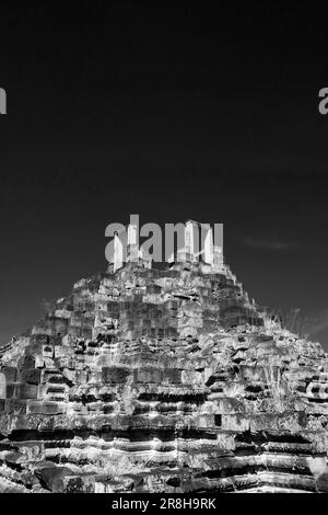 Skyward view of an ancient stone pyramid top from Cambodia, a medieval ...