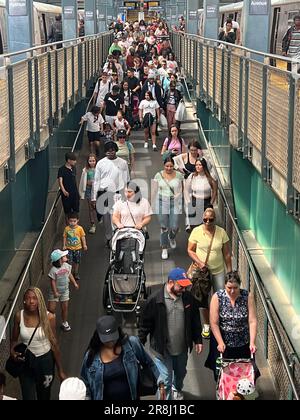 Crowds of beach goers exit the Stillwell Avenue subway train station at ...