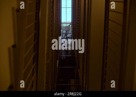 Stairwell and elevator in a residential building with a window on the ...