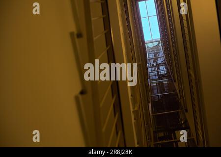 Stairwell and elevator in a residential building with a window on the ...