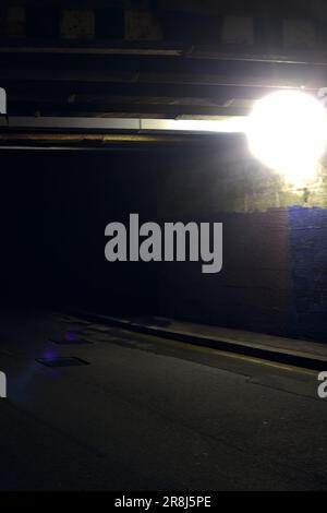 Underpass and pavement in an italian city at night Stock Photo - Alamy