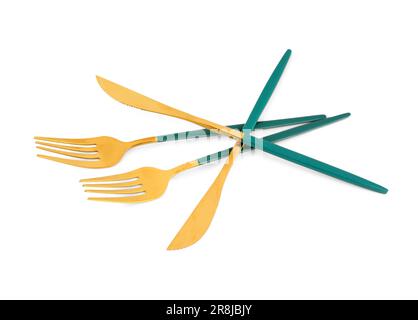 Golden forks and knives with green handles on white background Stock ...
