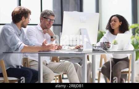 Conversation between managers and employees in the office Stock Photo ...