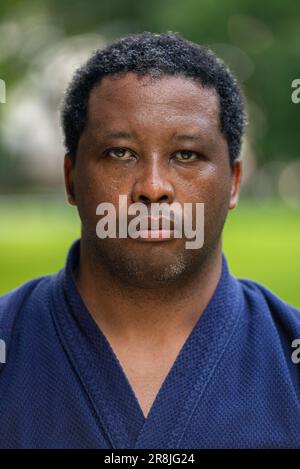 Portrait of handsome black martial artist man with martial arts costume ...