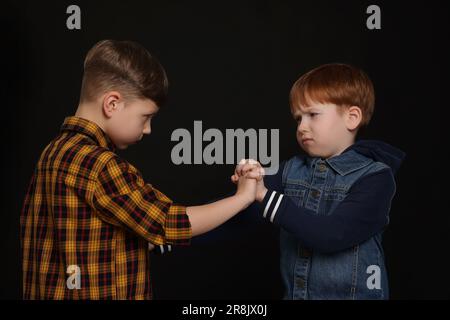 Two boys fighting on white background. Children's bullying Stock Photo ...