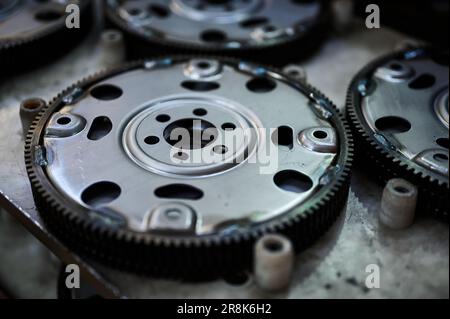 Car engine flywheels on shelf at auto production factory Stock Photo ...