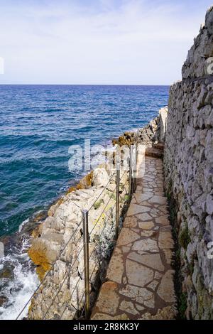 pathway stones tiles to access water sand beach in south Antibes Juan ...