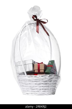 Wicker basket full of gift boxes on white background Stock Photo - Alamy