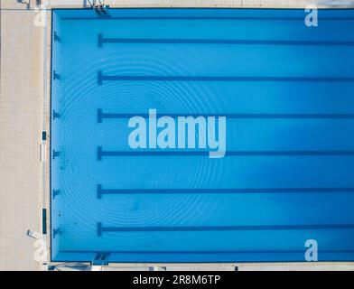 Aerial zenithal view of the swimming pool of the village of Miralcamp ...