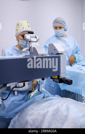 Surgeons performing eye surgery in the operating room Stock Photo - Alamy