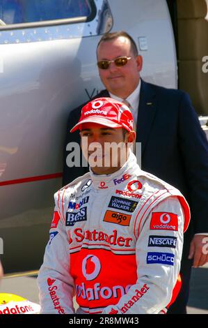 Lewis Hamilton at a press event with McLaren F1 car and Vistajet ...