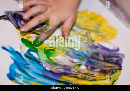 Small children's hands finger painting with different colours Stock ...