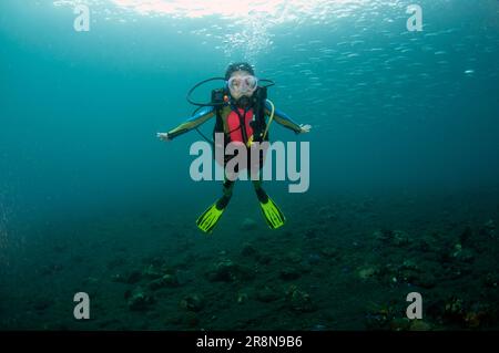 8 year-old girl diving, Liberty Wreck dive site, Tulamben, Karangasem ...