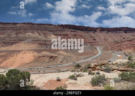 The Moab Fault line stretching across wingate sandstone mountains above ...