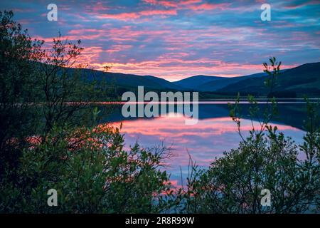sunset looking over loch in galloway forest scotland Stock Photo - Alamy