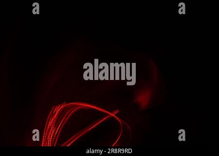 long exposure movement of a red lantern in the dark closeup Stock Photo ...
