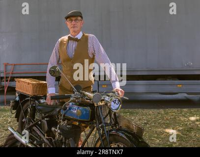 A portrait of the proud owner of a Triumph Model NSD motorcycle ...