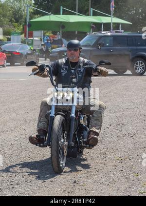 Members of The Outlaws Motorcycle Club arriving at a motorcycle rally ...