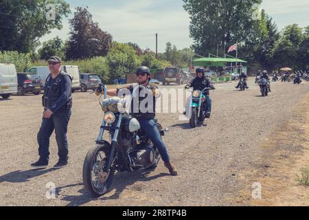 Members of The Outlaws Motorcycle Club arriving at a motorcycle rally ...