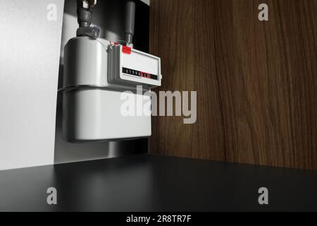 Electric meter near white wall, space for text. Gas measuring device ...