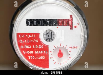Electric meter on blurred background, closeup view. Water measuring ...