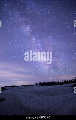 Lingering snow and Milky Way Stock Photo - Alamy