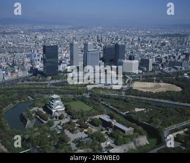 Aerial view of Osaka Castle with high-rise buildings of Osaka Business ...